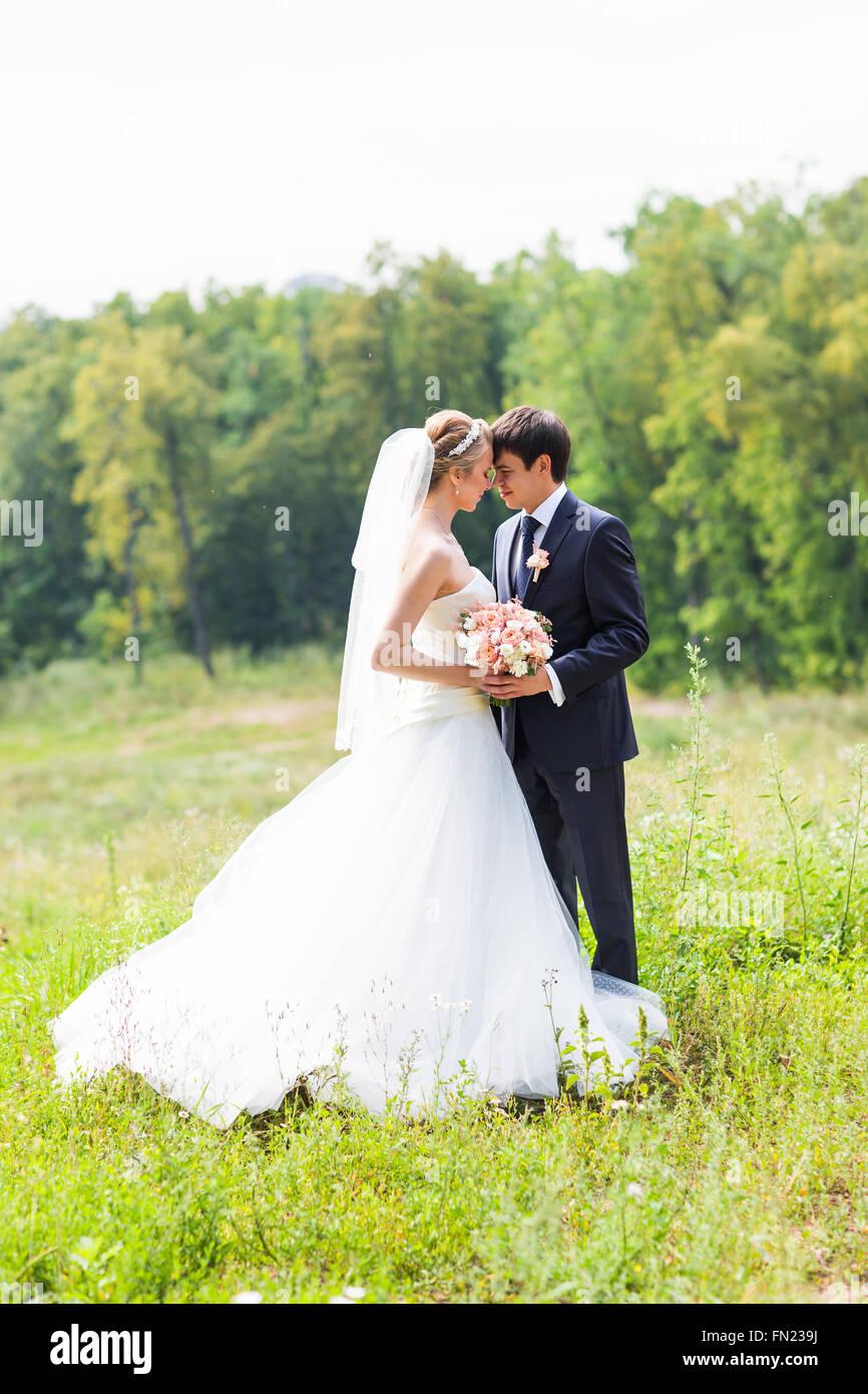 Wedding, Beautiful Romantic Bride and Groom Embracing Stock Photo - Alamy
