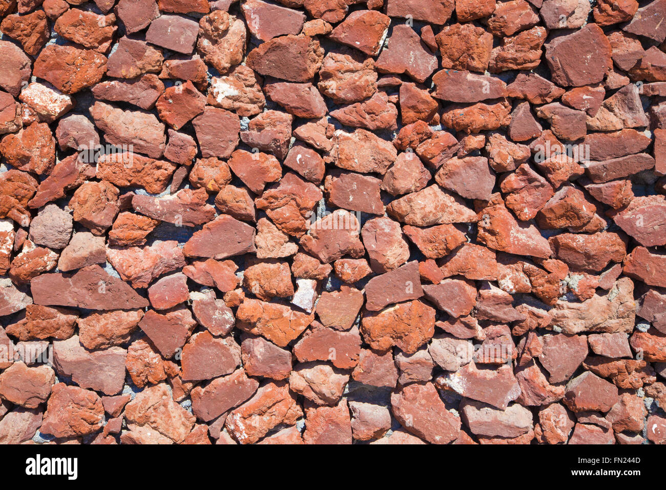 Santorini - Red pumice wall background Stock Photo - Alamy