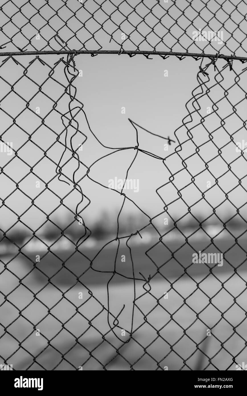 Torn rusty grid on the football field Stock Photo - Alamy