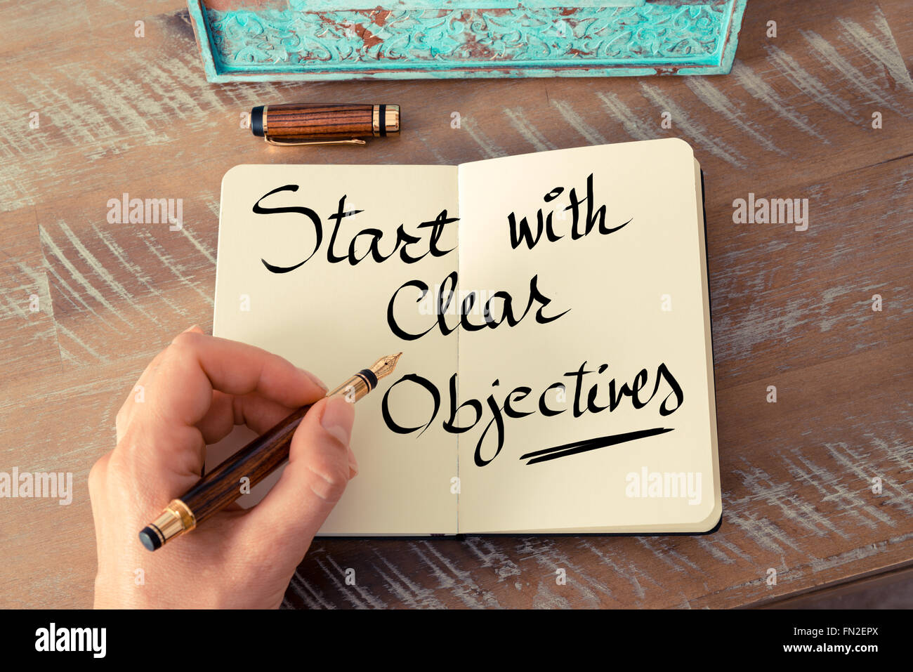 Retro effect and toned image of a woman hand writing a note with a ...