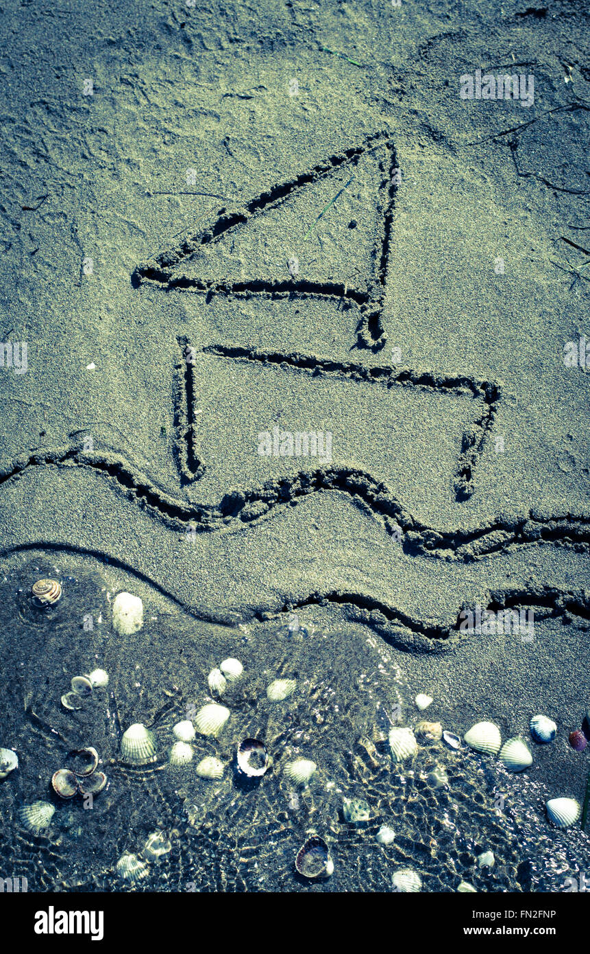 boat drown into sand on beach Stock Photo - Alamy