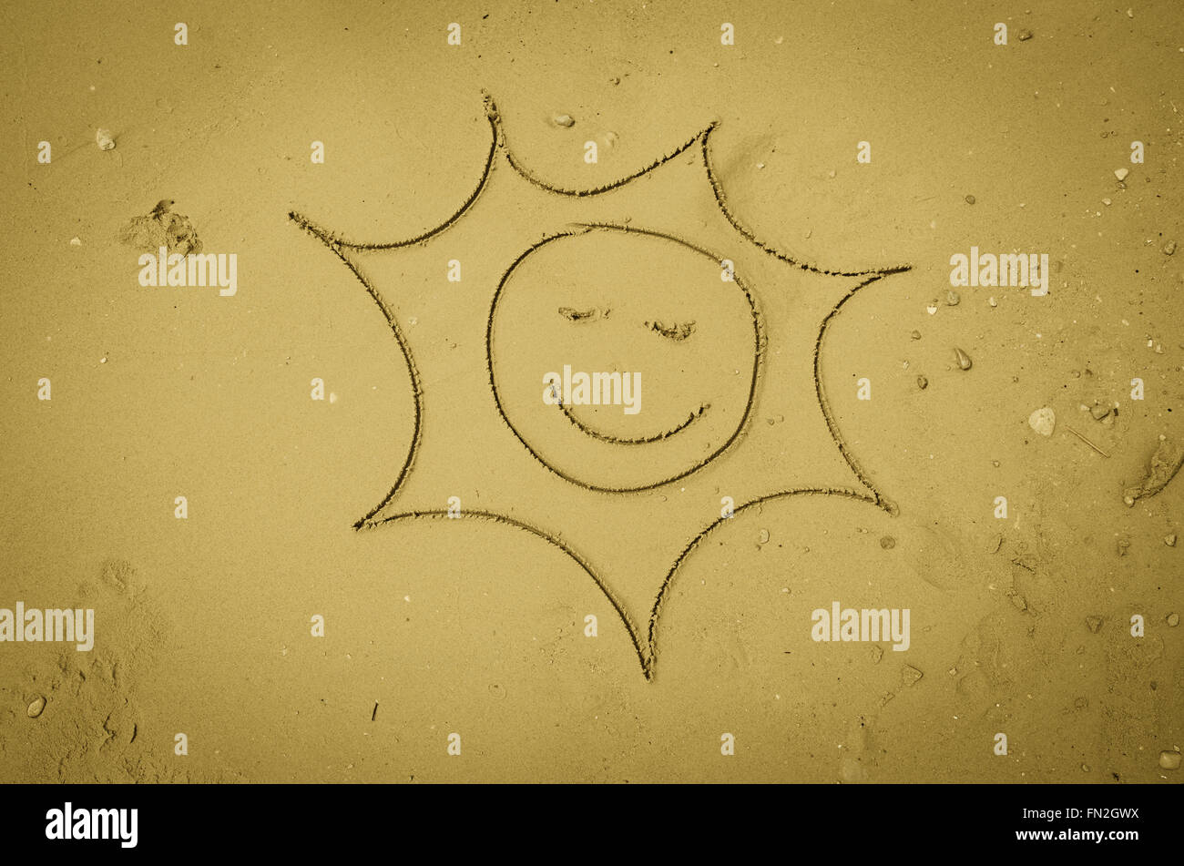 sun in sand on beach Stock Photo - Alamy