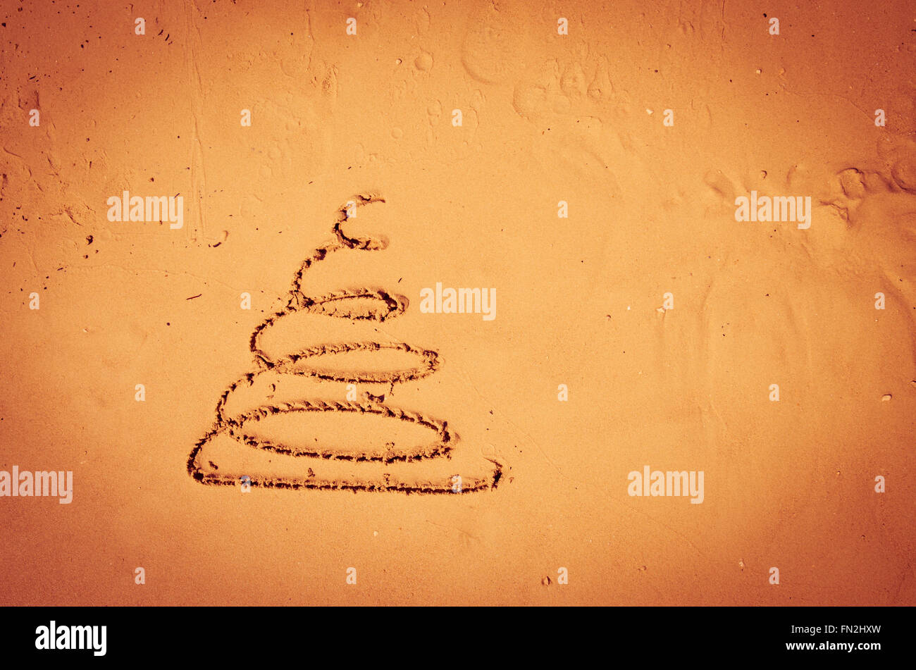Christmas tree drawn into sand on beach Stock Photo - Alamy