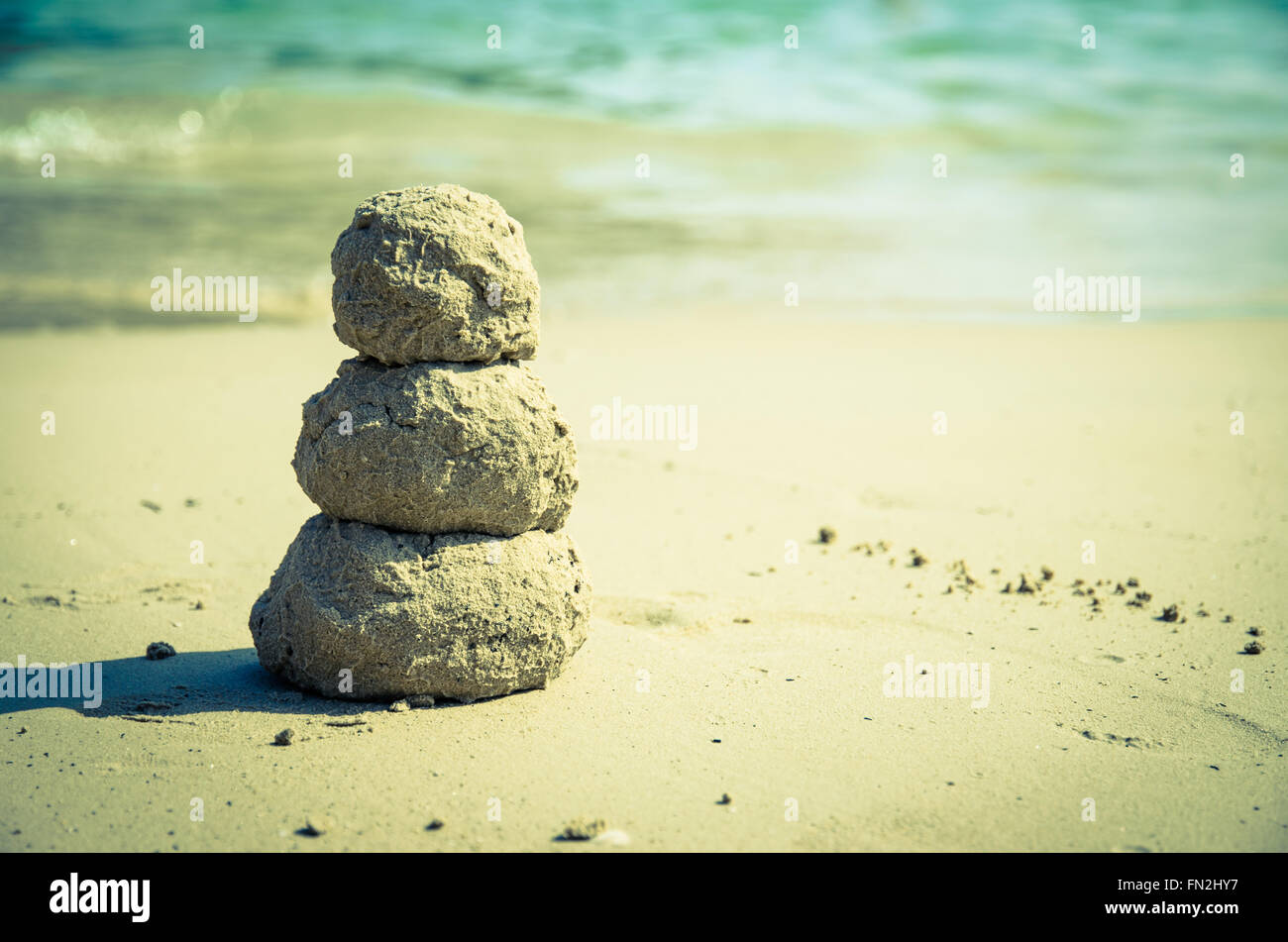 figure made from sand on the beach Stock Photo - Alamy