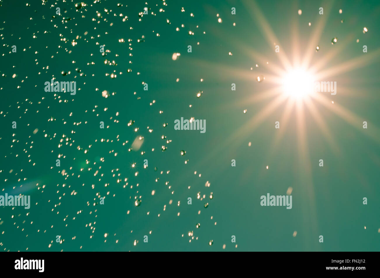 sunshine and drops of water on blue sky background Stock Photo - Alamy