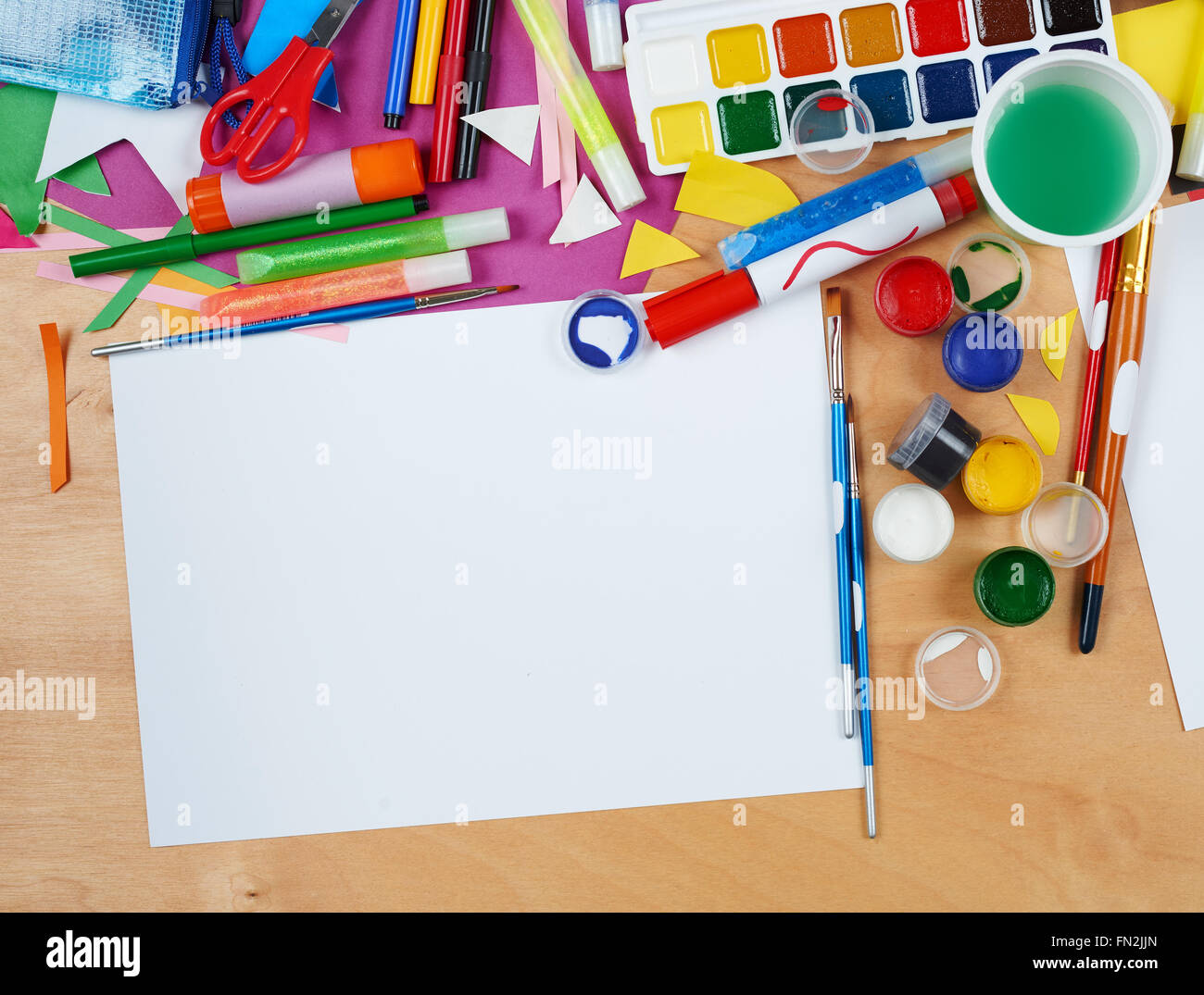 artwork workplace with creative accessories, art tools for painting and ...