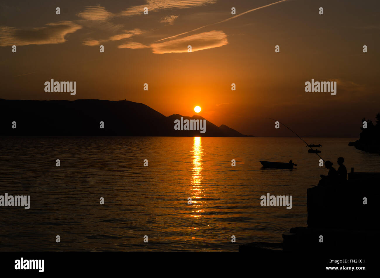 yellow sunset over sea image Stock Photo - Alamy