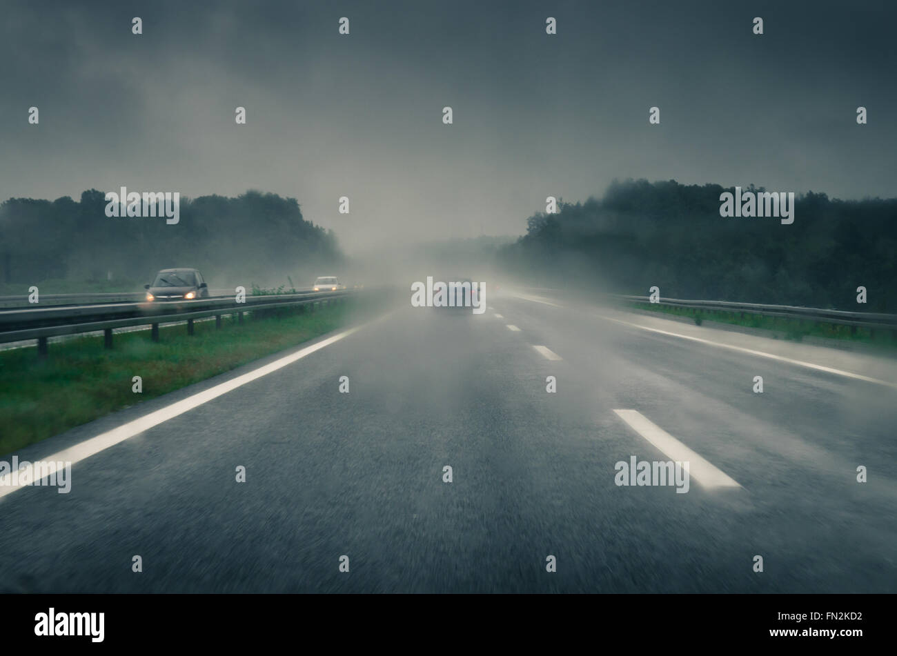car on a road in rainy weather Stock Photo - Alamy