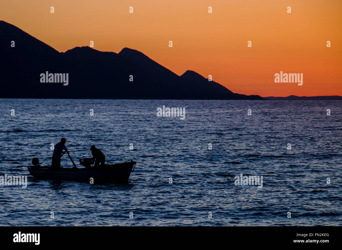 fishmen in boat on sea Stock Photo - Alamy