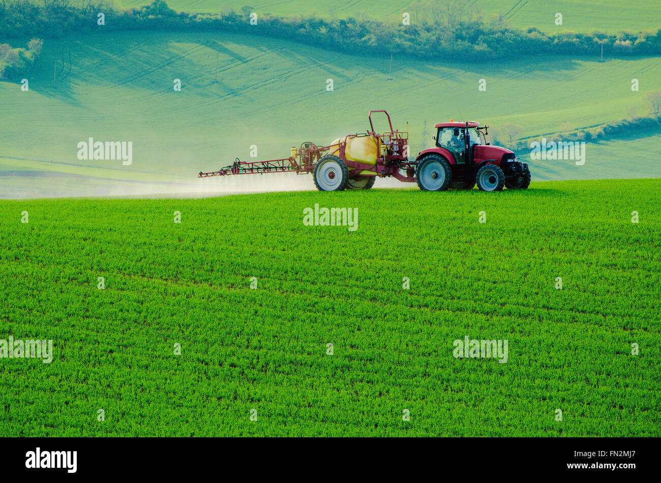 Farm machinery spraying insecticide Stock Photo - Alamy