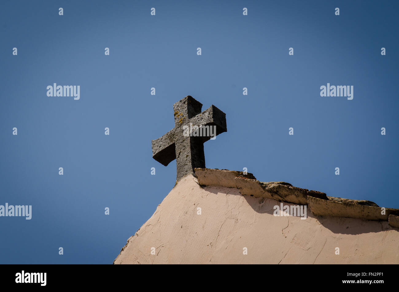 single stone cross over blue sky Stock Photo - Alamy