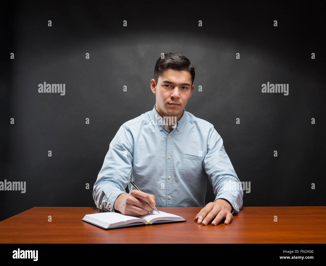 Student writing paper desk hi-res stock photography and images - Alamy