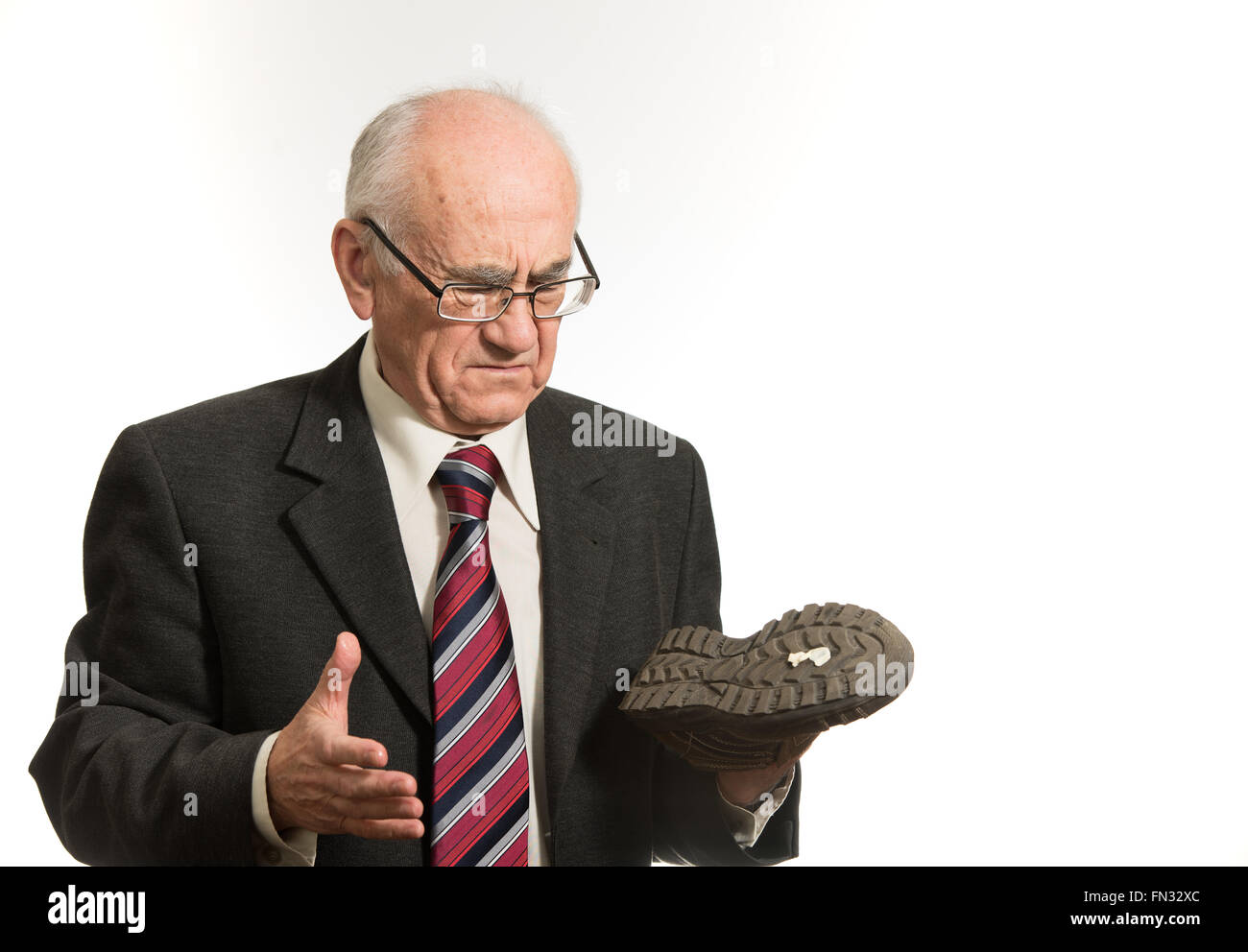 old senior businessman stepped in chewing gum Stock Photo - Alamy