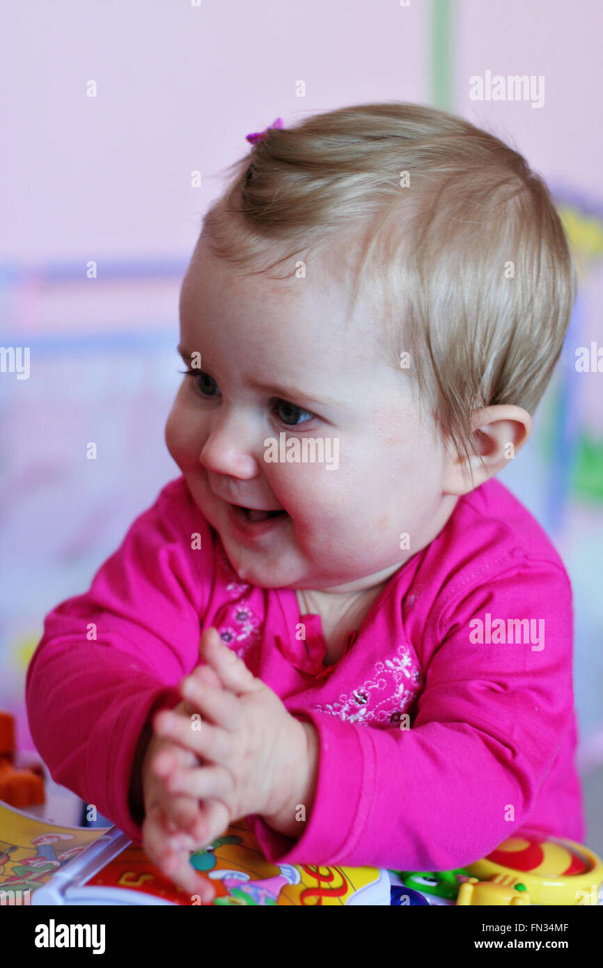 Baby girl child kid learning, clapping her hands, milestones Stock ...