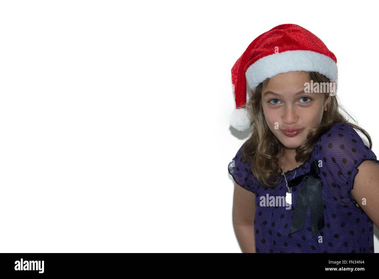 Little girl with Santa hat Stock Photo - Alamy