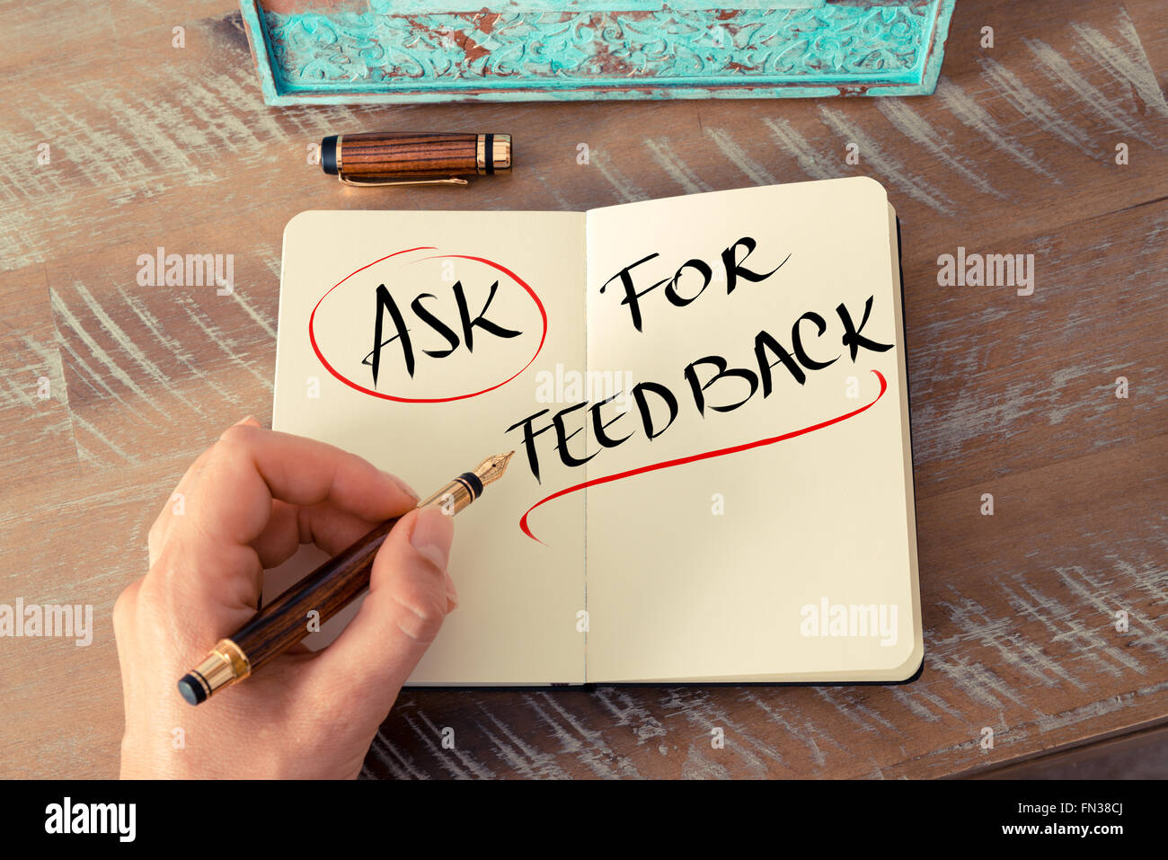 Retro effect and toned image of a woman hand writing a note with a ...