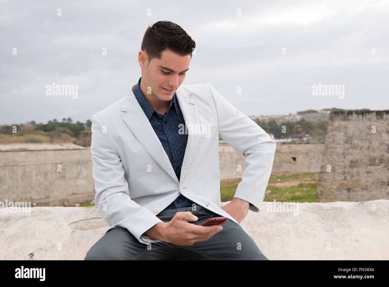 Cuban using mobile phone hi-res stock photography and images - Alamy