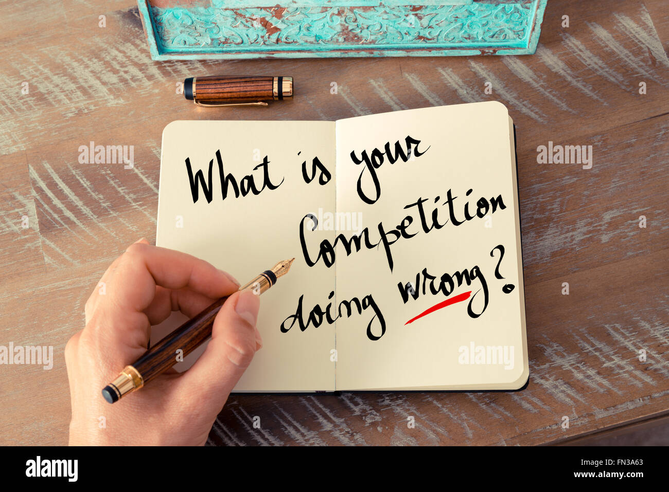 Retro effect and toned image of a woman hand writing a note with a ...