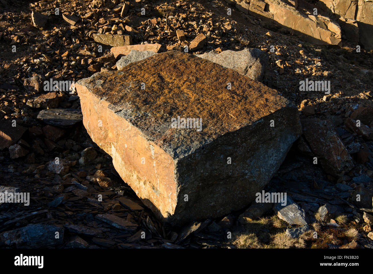 Large block of rock in a disused quarry in North Wales Stock Photo - Alamy