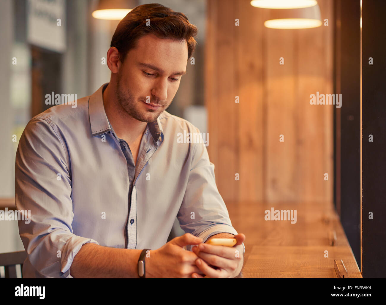Man sitting at the table Stock Photo - Alamy