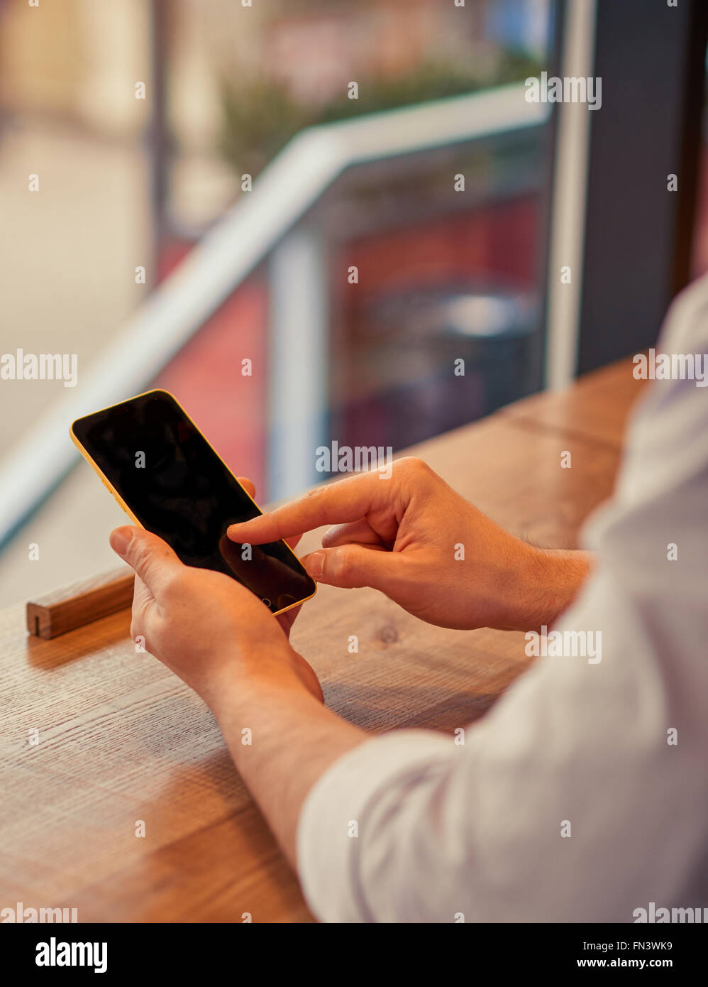 Man holding mobile phone Stock Photo - Alamy