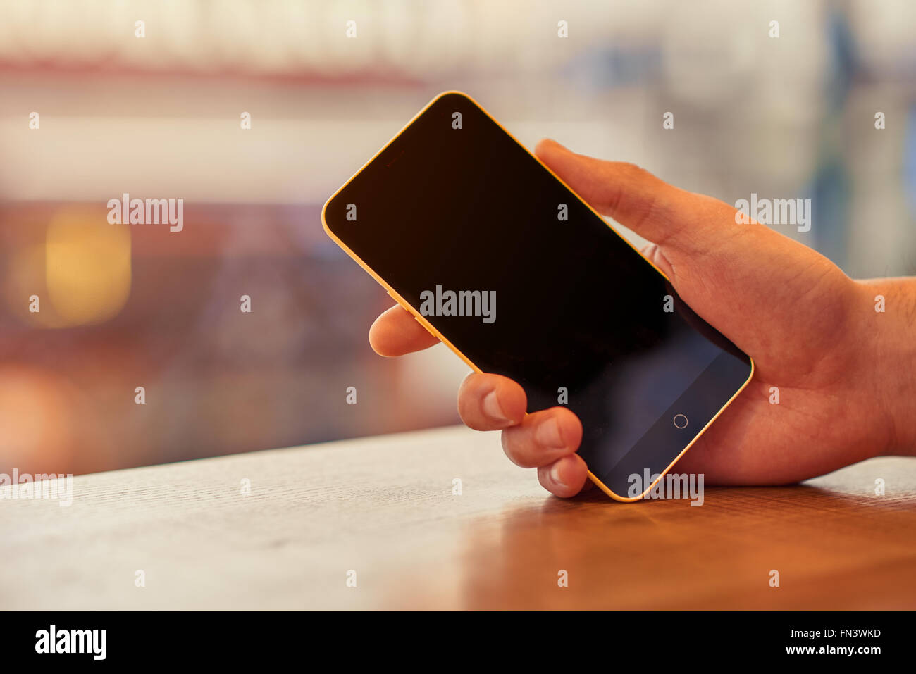 Man holding mobile phone Stock Photo - Alamy