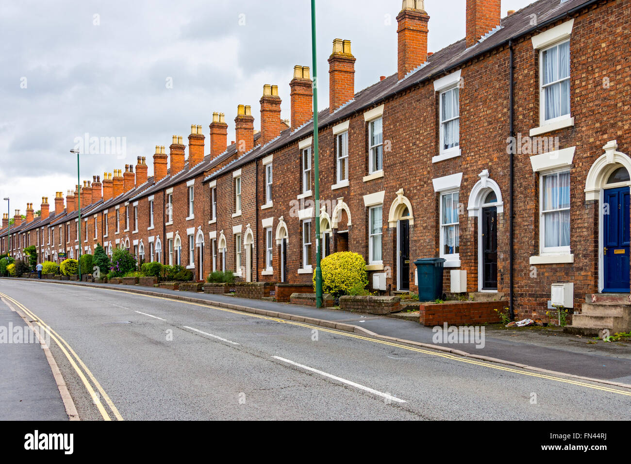 A long line of terraced houses on a road in Shrewsbury, Shropshire ...