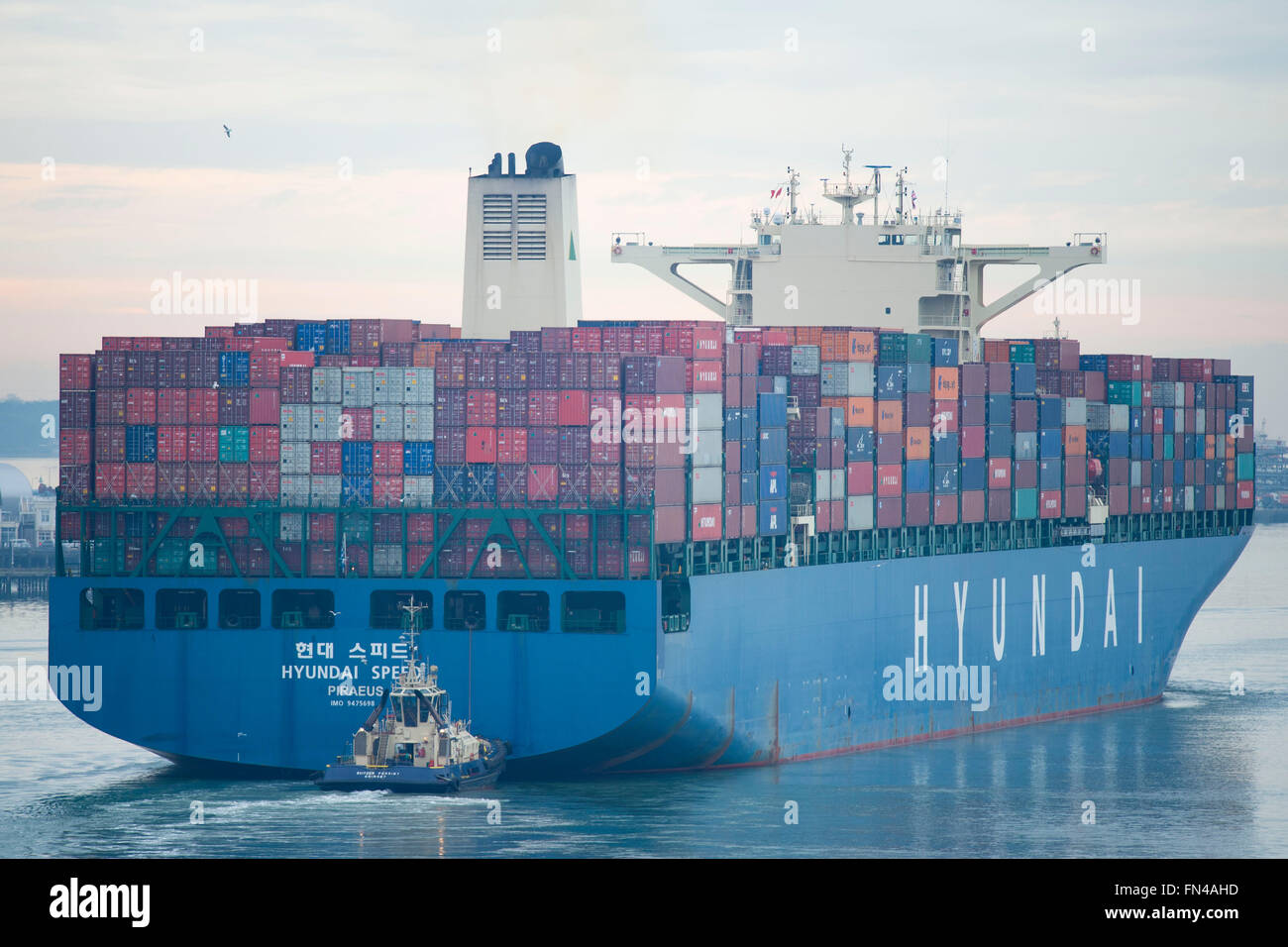 A Hyundai container cargo ship leaving Southampton dock in England, UK ...