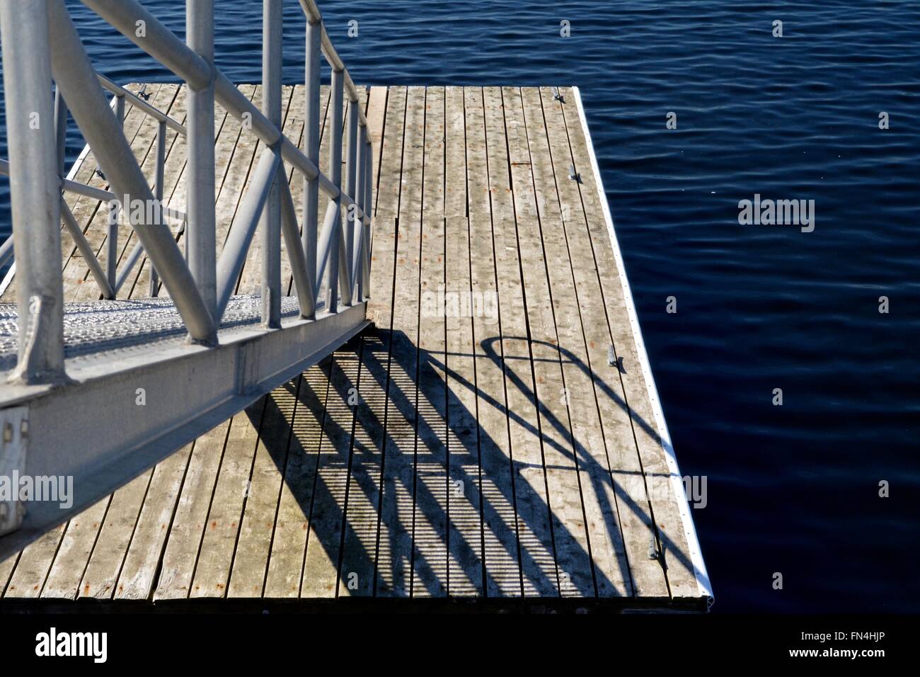 Wood dock with metal ramp for docking boats Stock Photo - Alamy