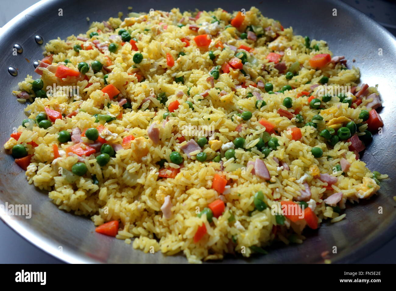 Ham and Vegetable Saffron Fried Rice Stock Photo - Alamy