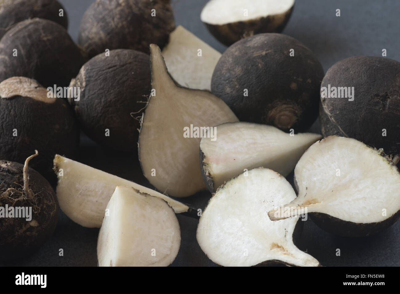 fresh raw black turnip on table Stock Photo - Alamy