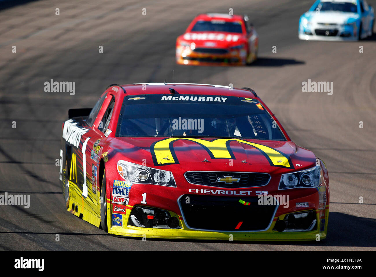 Avondale, AZ, USA. 13th Mar, 2016. Jamie McMurray (1) battles for ...