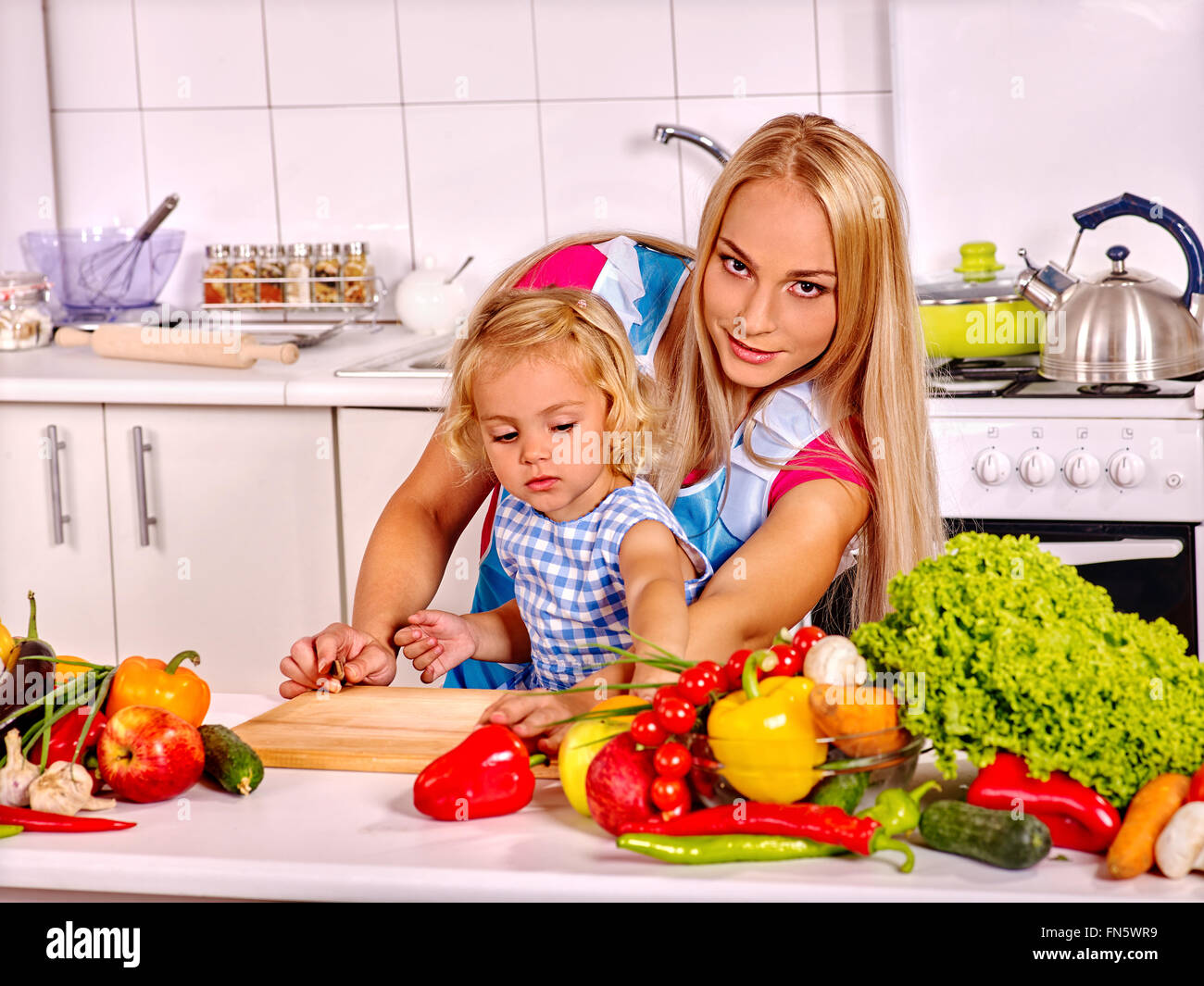Mother and child cooking at kitchen Stock Photo - Alamy
