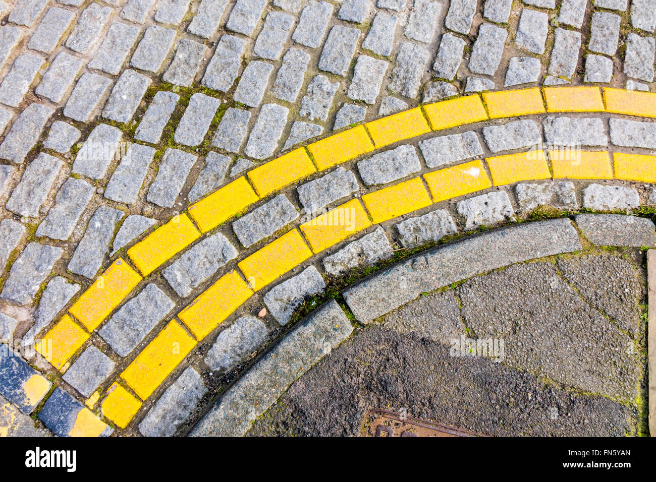 Double Yellow line no parking road markings on a surface finished in ...