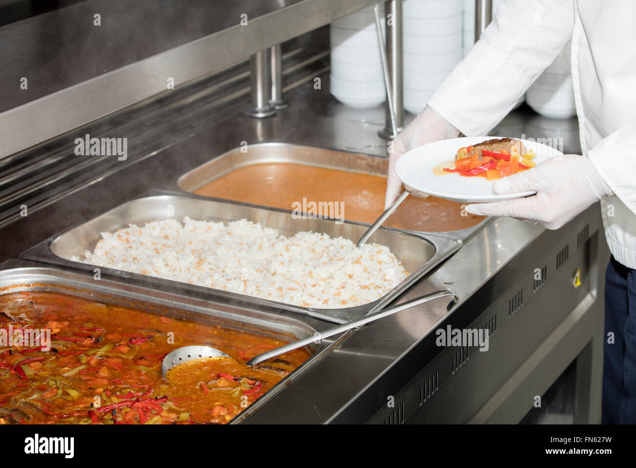 chef standing behind full lunch service station Stock Photo - Alamy