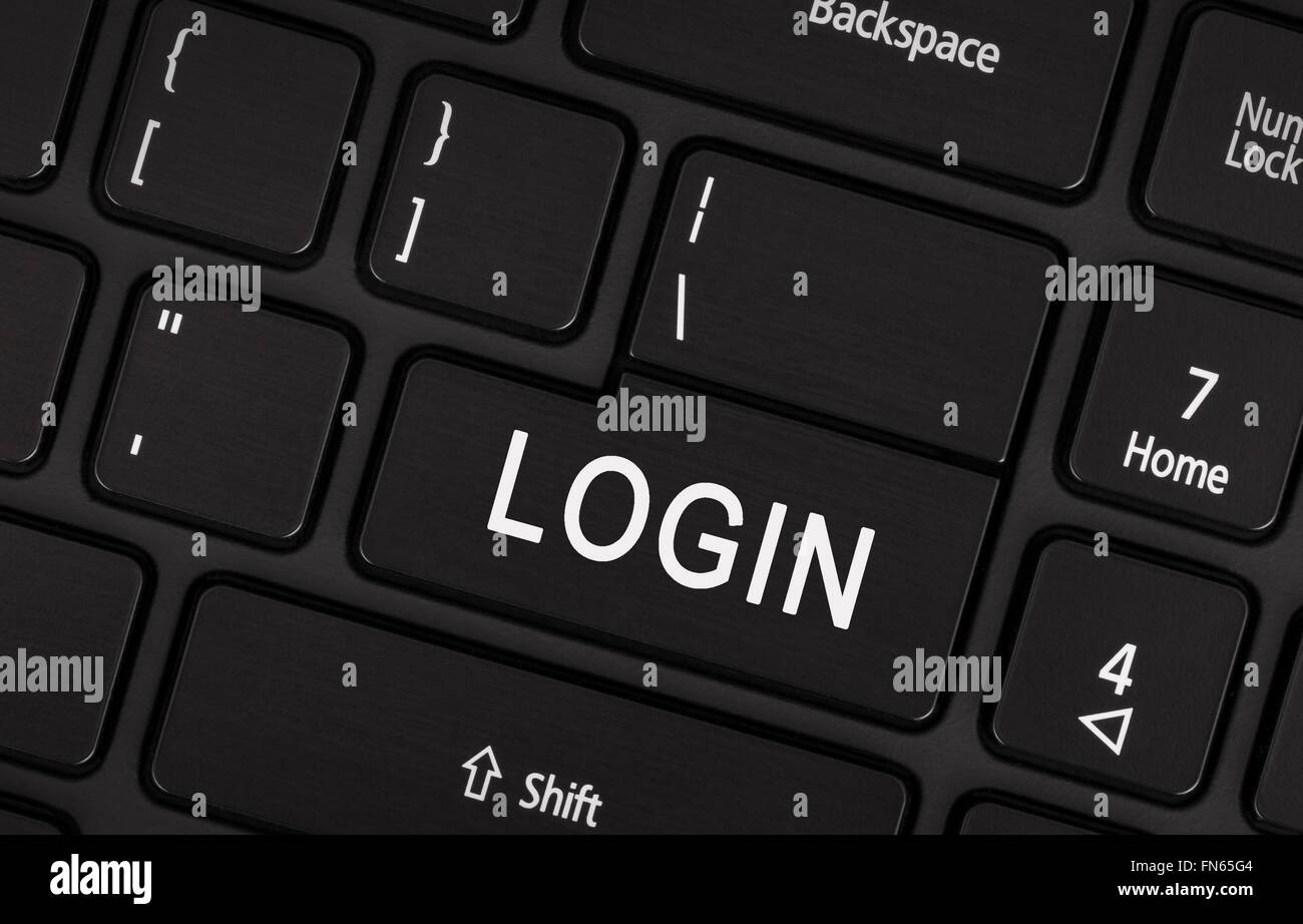 Black login button on modern laptop keyboard Stock Photo - Alamy