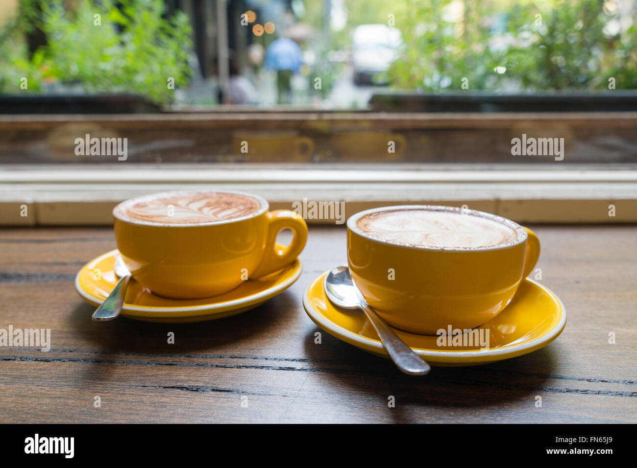 Enjoying coffee in a cafe Stock Photo - Alamy