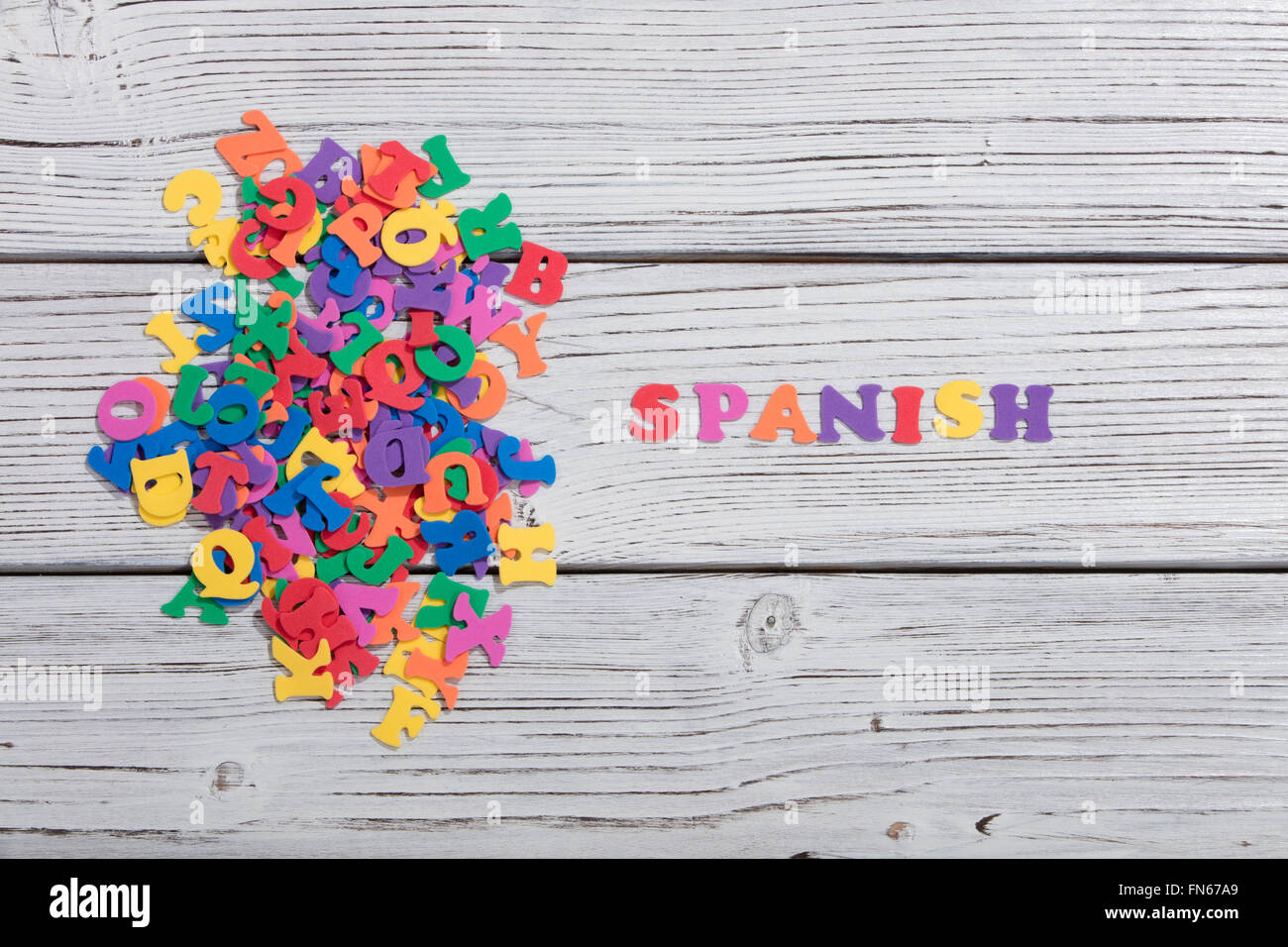 colorful words on white wooden background Stock Photo - Alamy