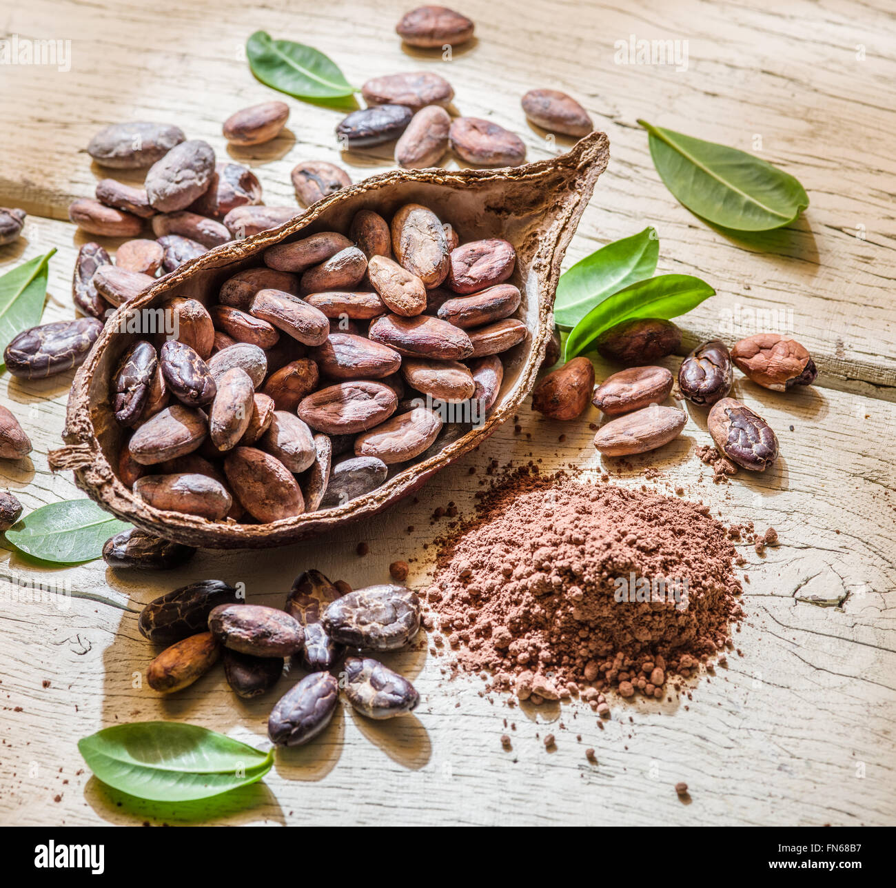 Cacao pod and cacao beans on the wooden table Stock Photo - Alamy