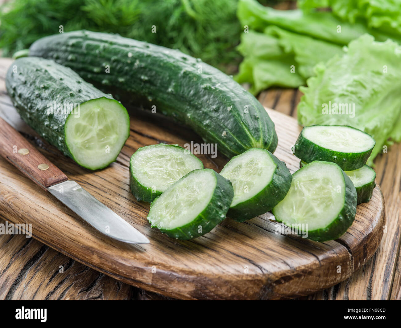 Cucumbers on the wooden table Stock Photo - Alamy
