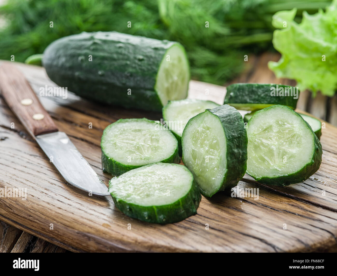 Cucumbers on the wooden table Stock Photo - Alamy