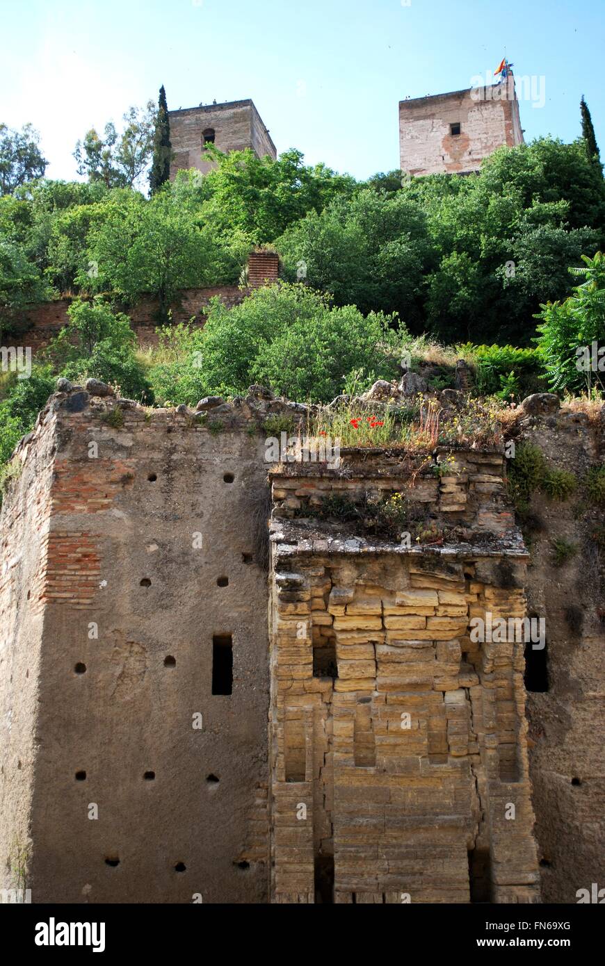 Ruins of a Moorish arch with the Alhambra above to rear along the ...
