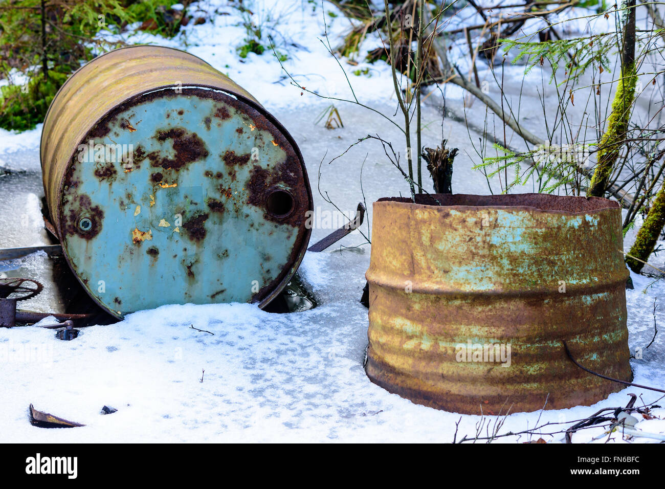 Two old and very degraded oil barrels left in nature to rust Stock ...