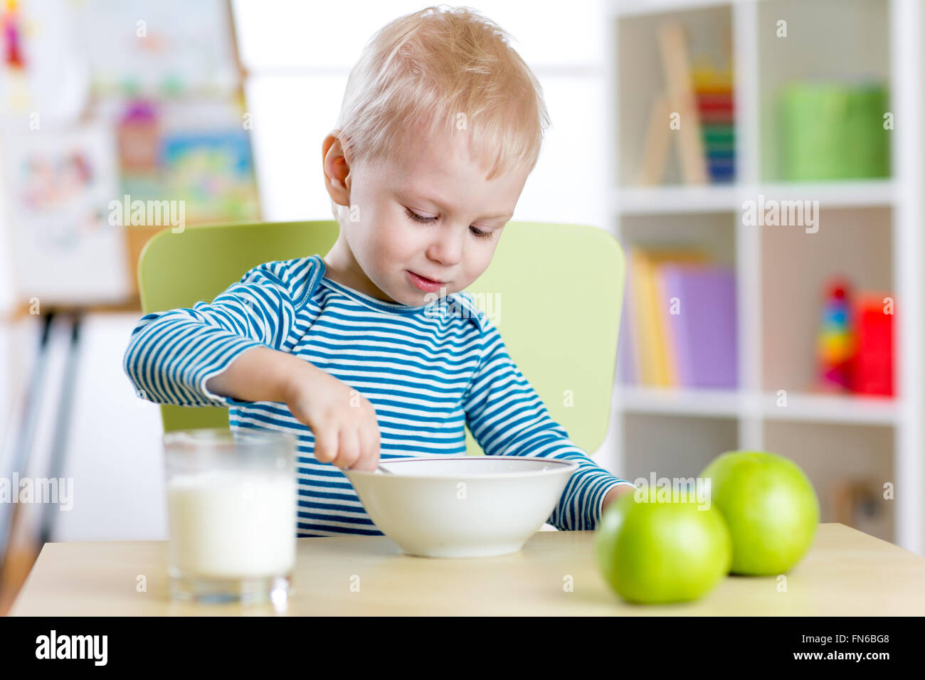 kid boy eating healthy food at home or kindergarten Stock Photo - Alamy