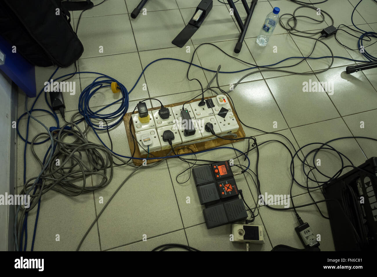 Tangled mess of cables to a power station Stock Photo - Alamy