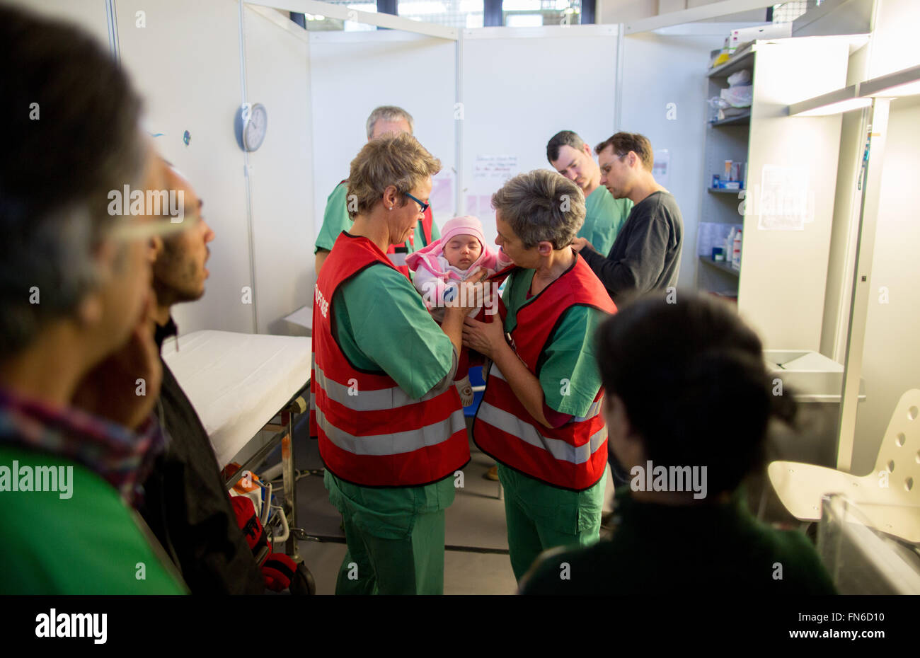 Nurses taking care of a sick refugee child at the Medical Center at the ...