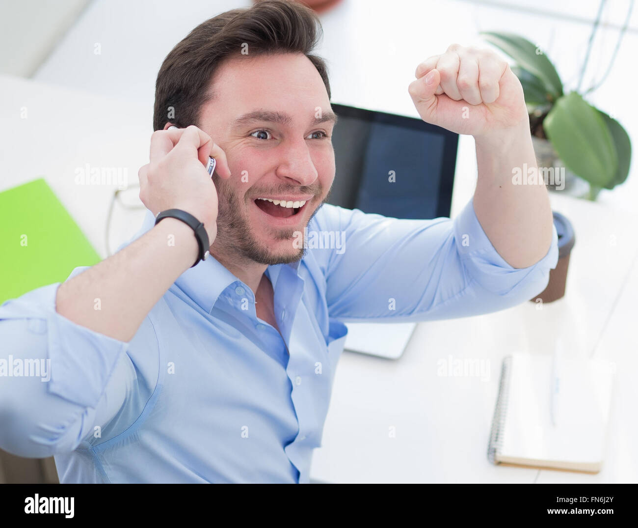 Freelancer speaking over phone Stock Photo - Alamy