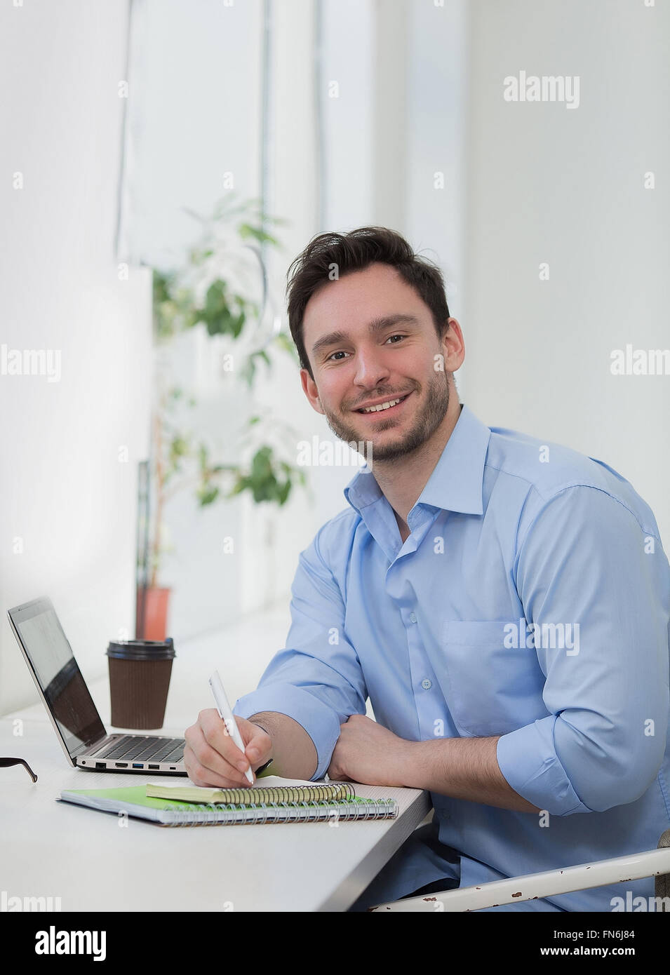 Male freelancer smiling using hi-res stock photography and images - Alamy