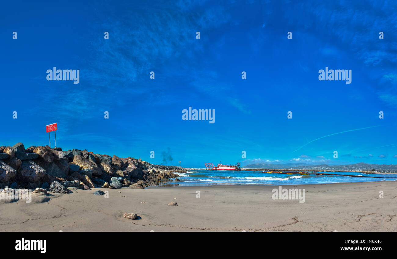 Deep blue sky and wispy clouds over dredge barge Stock Photo - Alamy