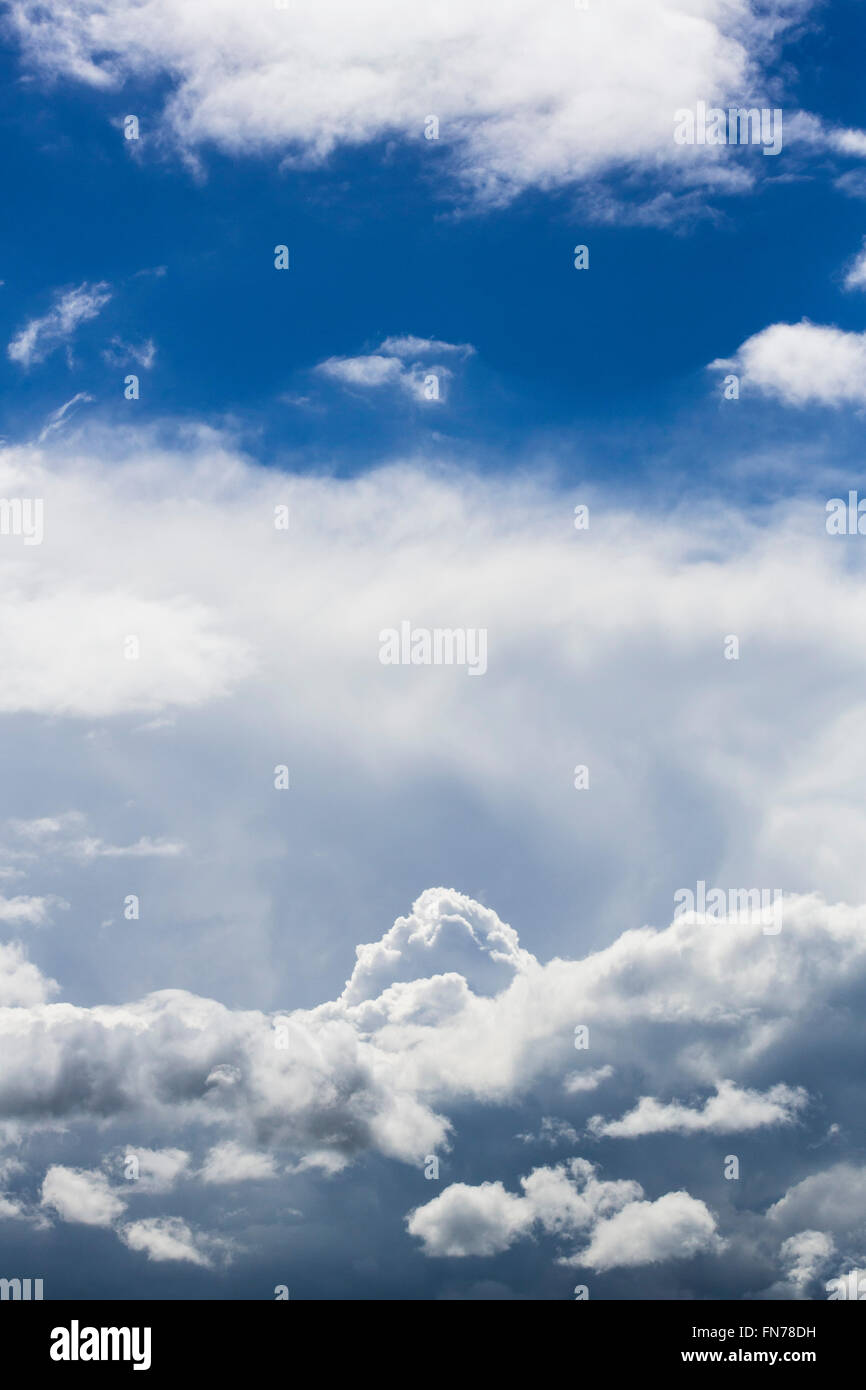 Clouds rising against blue sky hi-res stock photography and images - Alamy